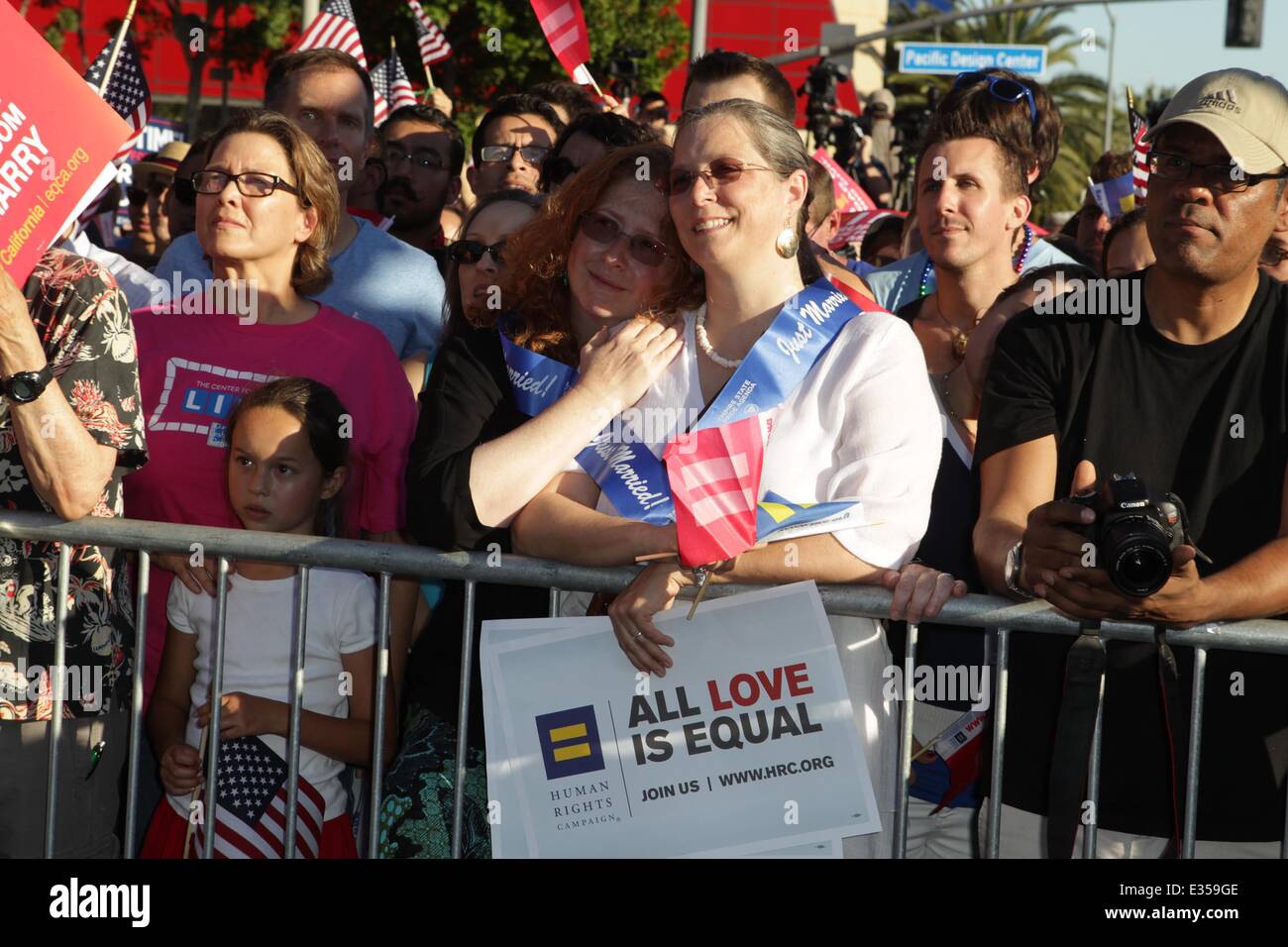 People attend a rally in West Hollywood to celebrate the U.S. Supreme Court's ruling that ...