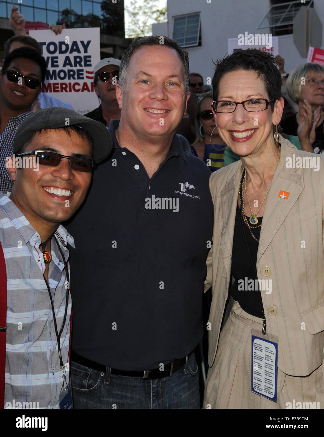 People attend a rally in West Hollywood to celebrate the U.S. Supreme ...