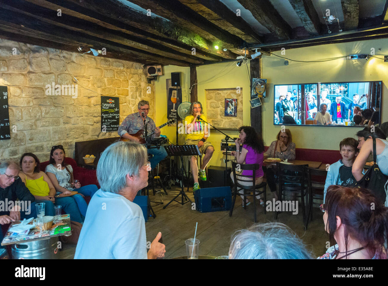 Paris, France, People inside Parisian Cafe Bistro listening to live ...