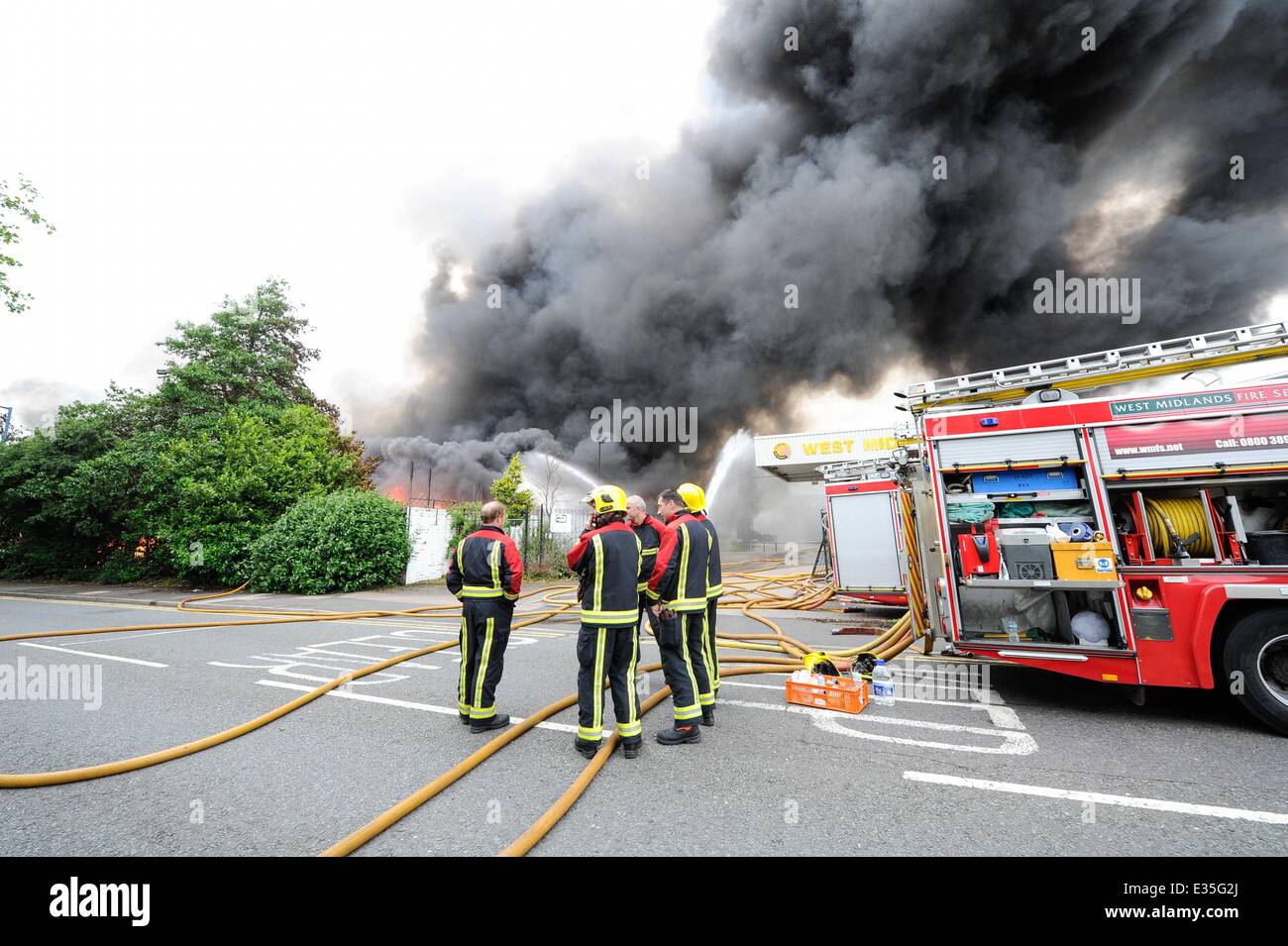 Firefighters at the scene of a blaze at a plastic recycling factory in ...