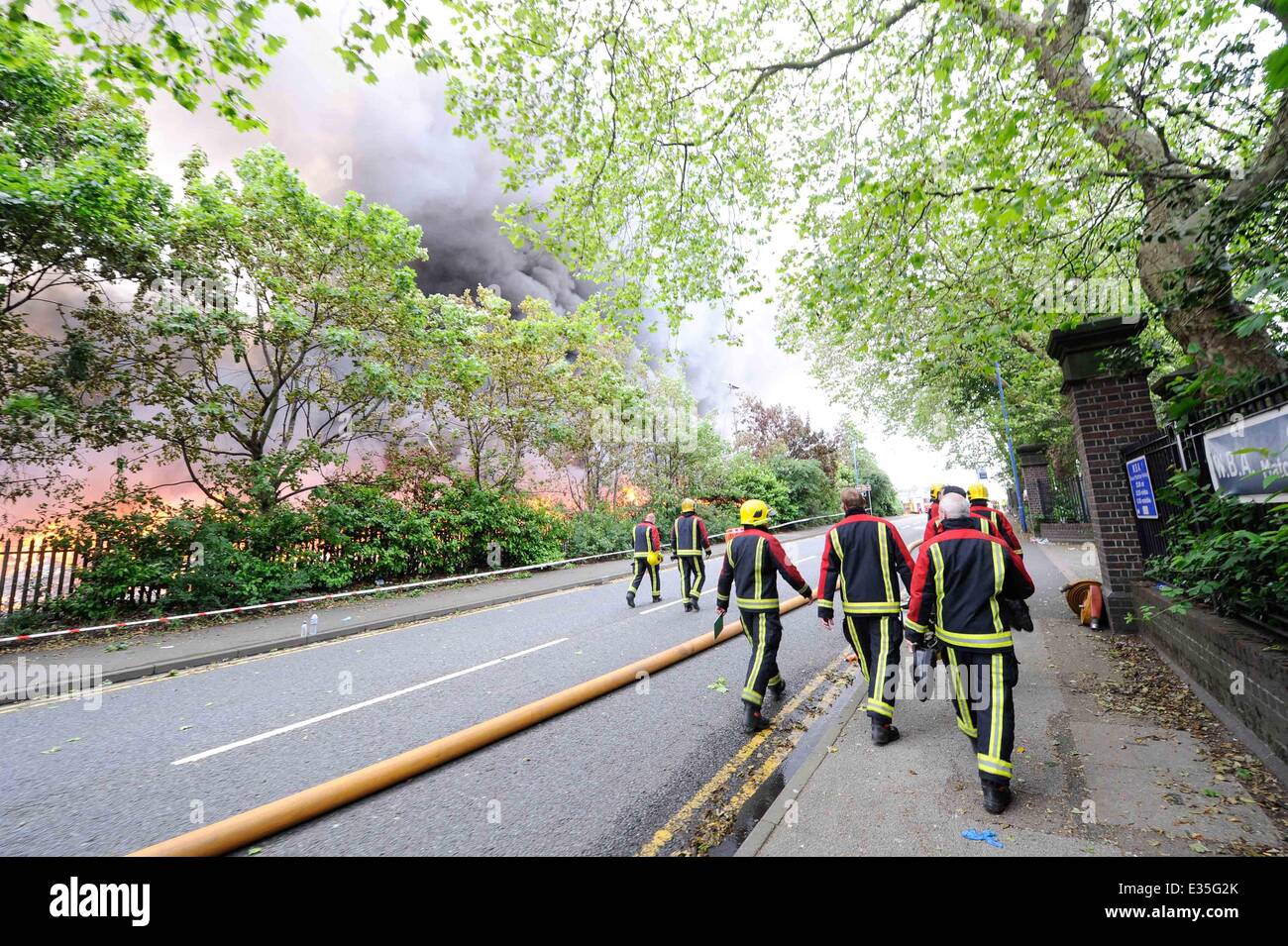 Firefighters at the scene of a blaze at a plastic recycling factory in ...