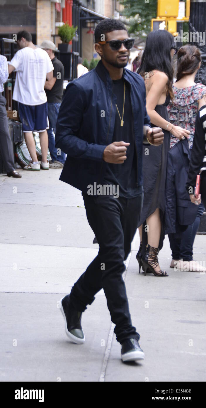 Usher leaving his Manhattan hotel to go to his Empire State Building ...