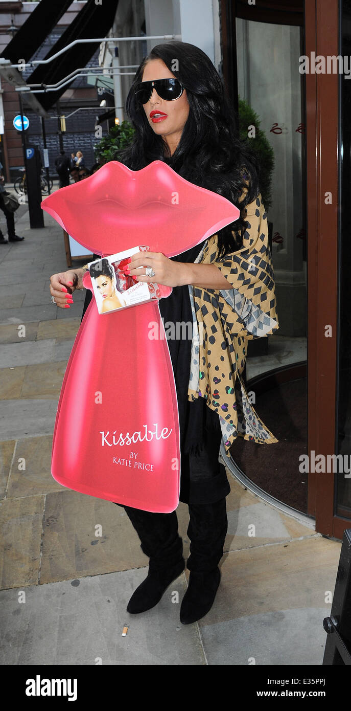 Katie Price leaves the Soho Sanctum hotel with an inflatable pair of ...