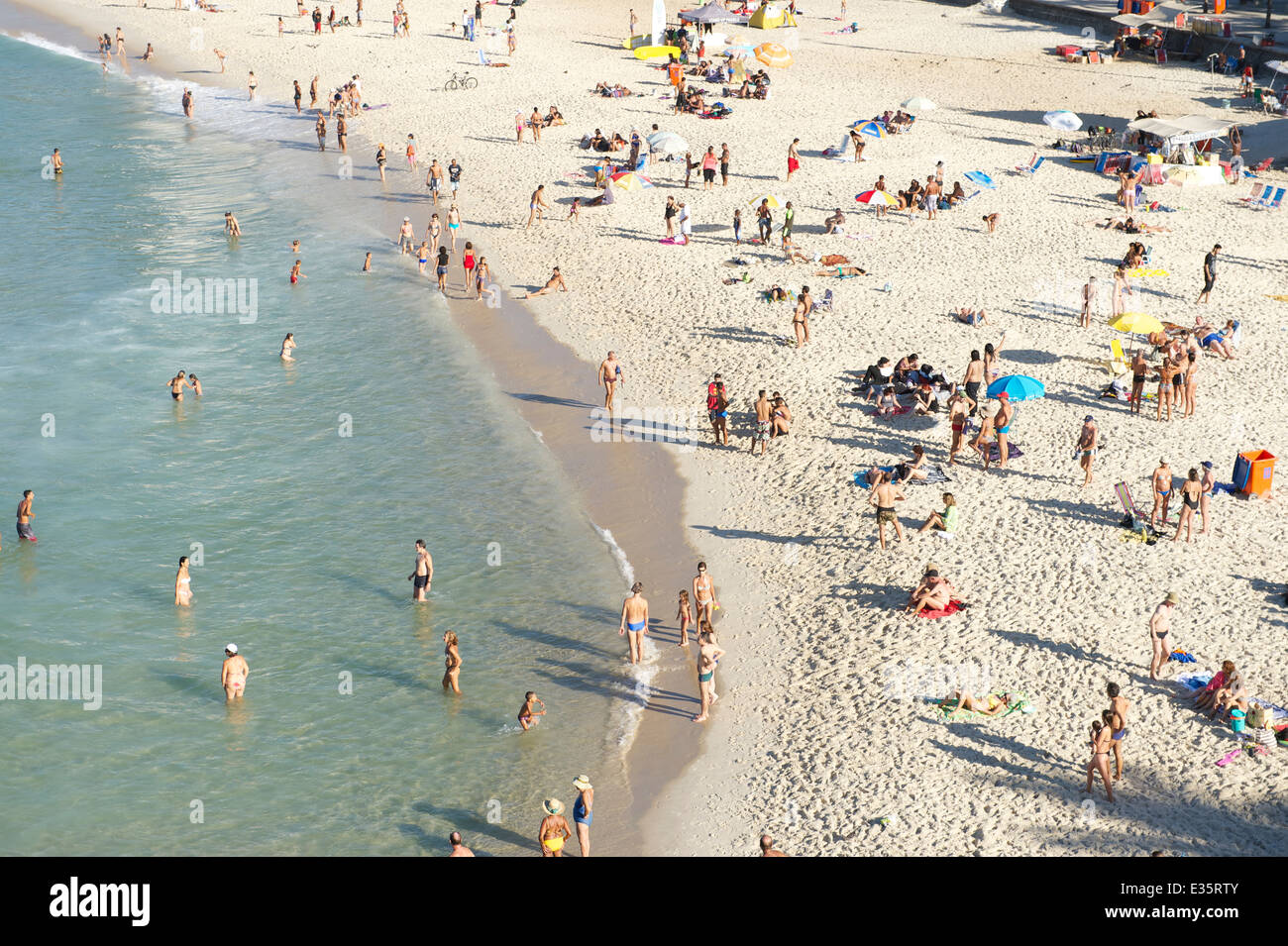 RIO DE JANEIRO, BRAZIL - FEBRUARY 2, 2014: Beachgoers relax on the ...
