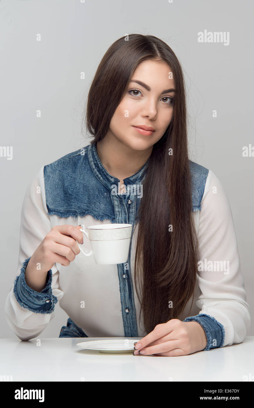 Vertical portrait of woman at the table Stock Photo - Alamy