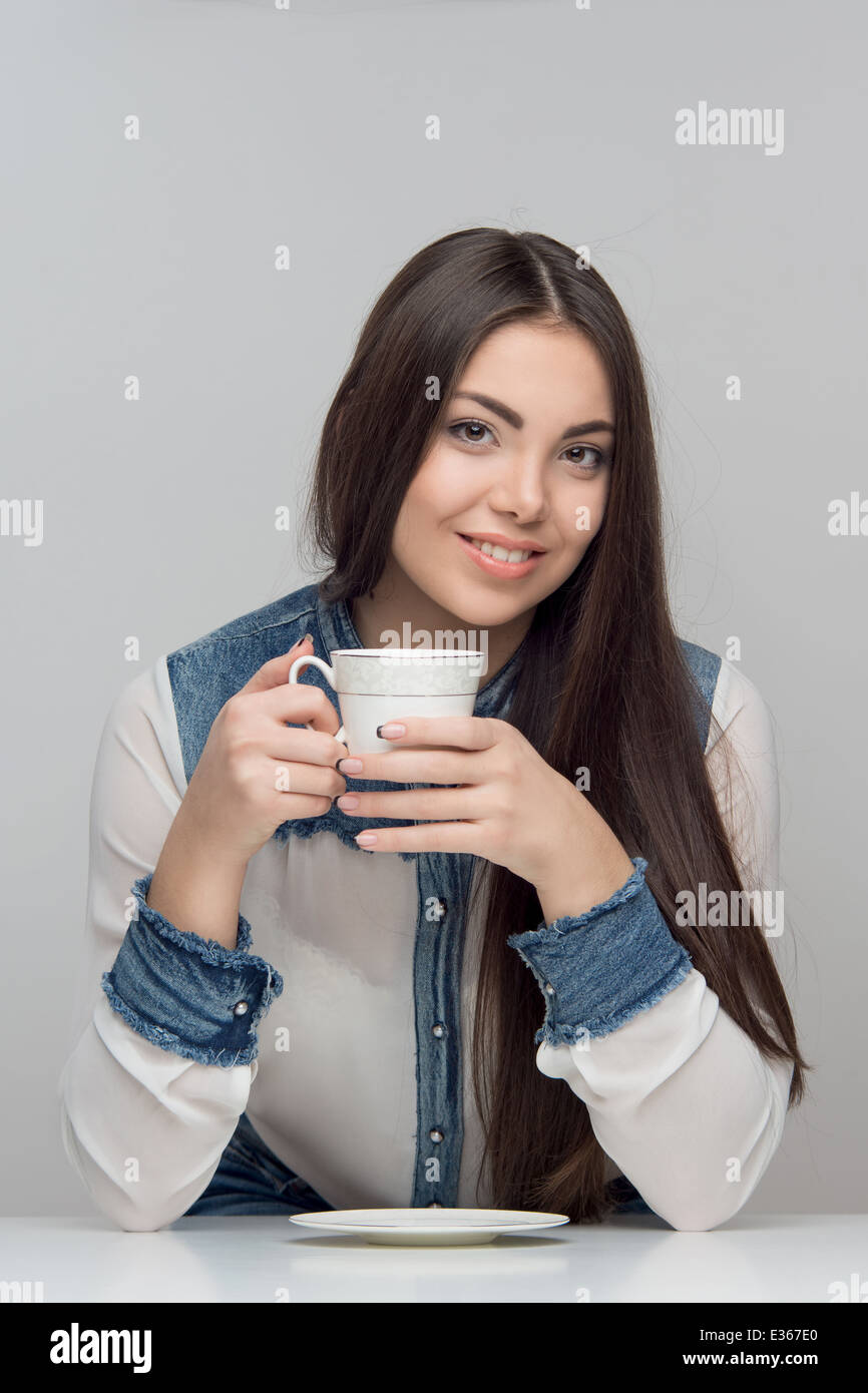 Vertical portrait of woman at the table Stock Photo - Alamy