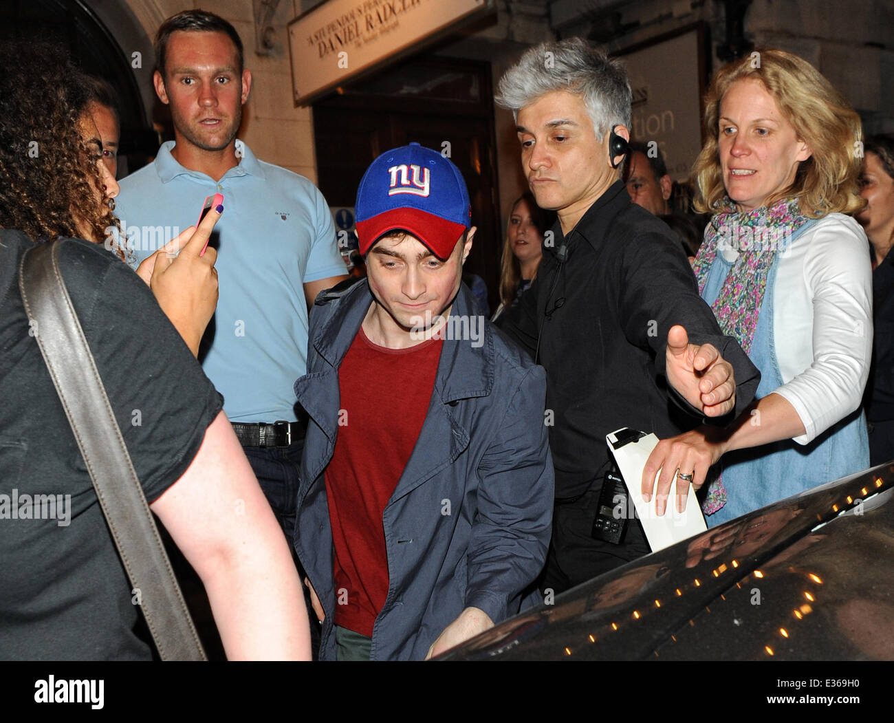 Daniel Radcliffe mobbed by fans as he leaves the Noel Coward Theatre ...
