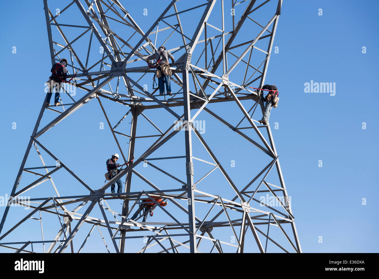 Construction crew assembling electricity transmission tower in Utah ...