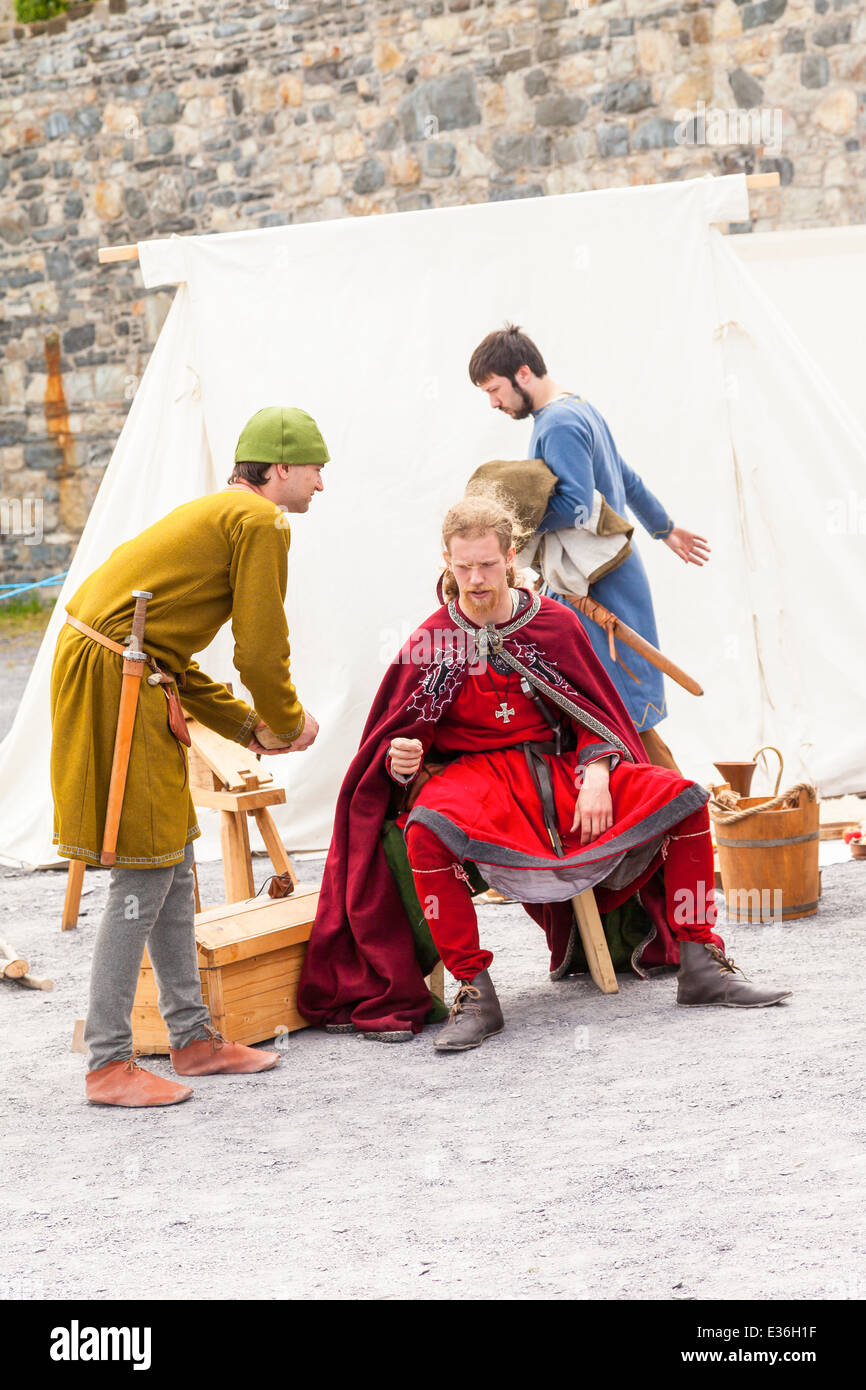 Actors in period costume performing an historical medieval re-enactment ...
