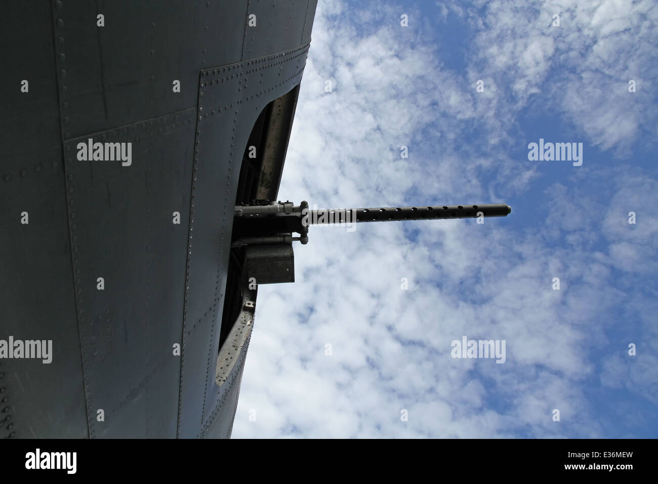 Looking up at a Browning .50 caliber machine gun pointing out of a WWII ...