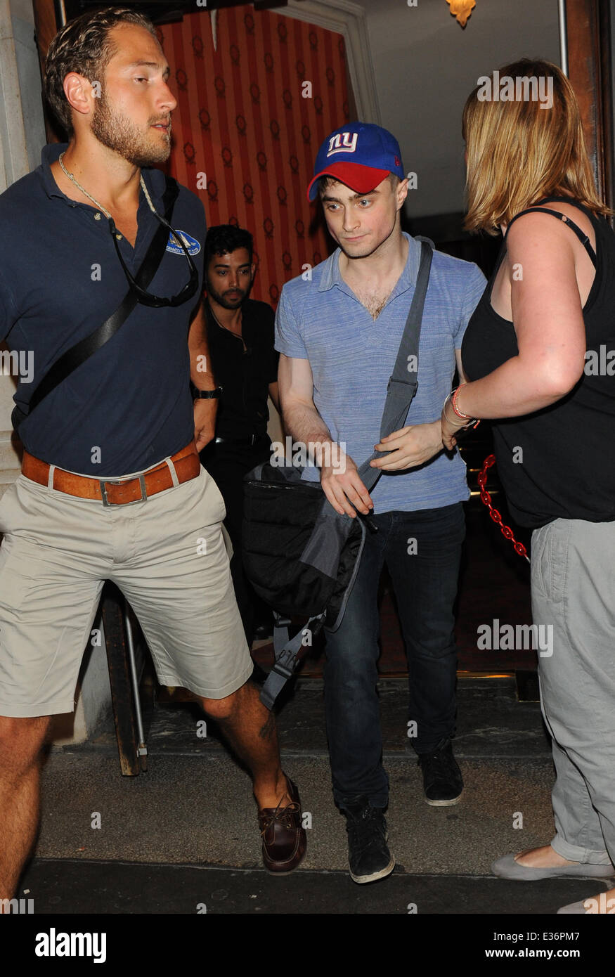 Daniel Radcliffe is ushered out of the Noel Coward Theatre by his ...
