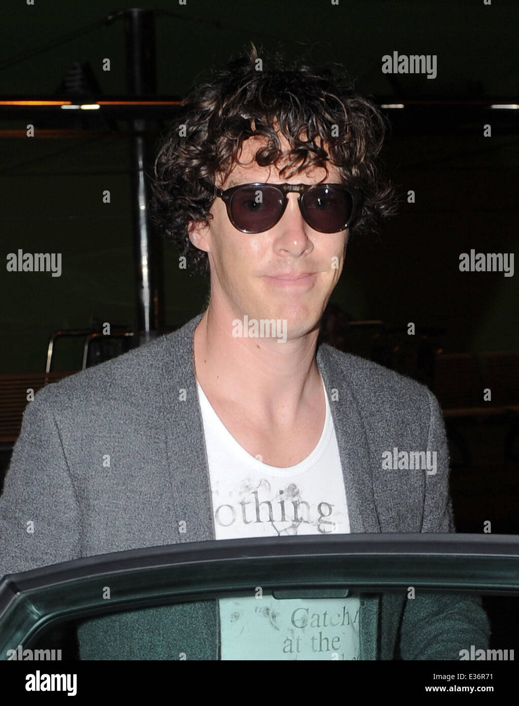 Benedict Cumberbatch arriving at Ibiza Airport wearing a suit jacket ...