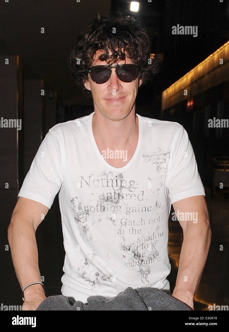 Benedict Cumberbatch arriving at Ibiza Airport wearing a suit jacket ...