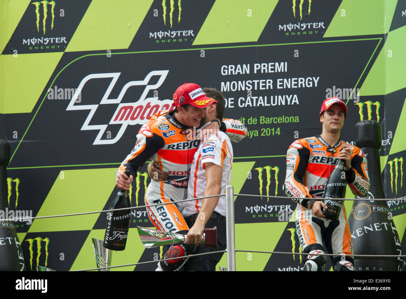 Marc Marques hugs the Repsol Honda team boss on the podium at Catalunya ...