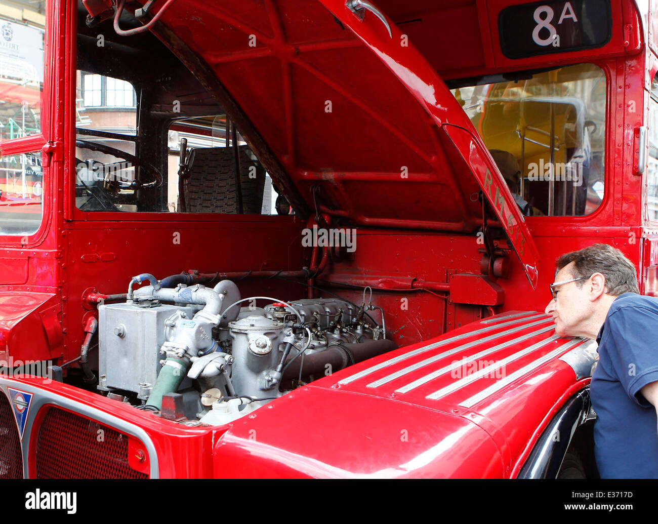 London, Britain. 22nd June, 2014. A visitor observes the engine of a ...