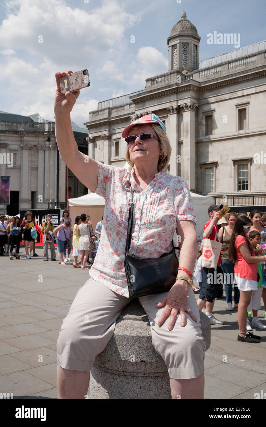 London, UK. 22nd June, 2014. Using every vantage point to take photos ...