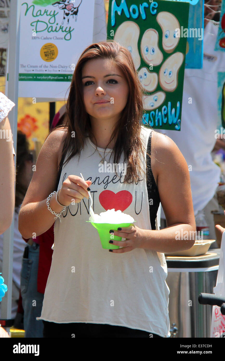 Ariel Winter takes a break to sit down in a stroller, as she enjoys a ...