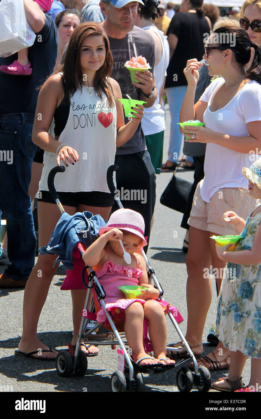 Ariel Winter takes a break to sit down in a stroller, as she enjoys a ...