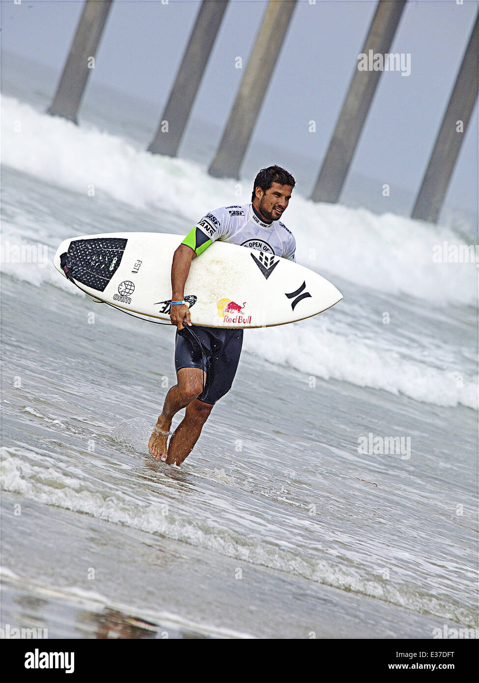 Alejo Muniz (BRA) winner of the 2013 U.S. Open of Surfing makes his way ...