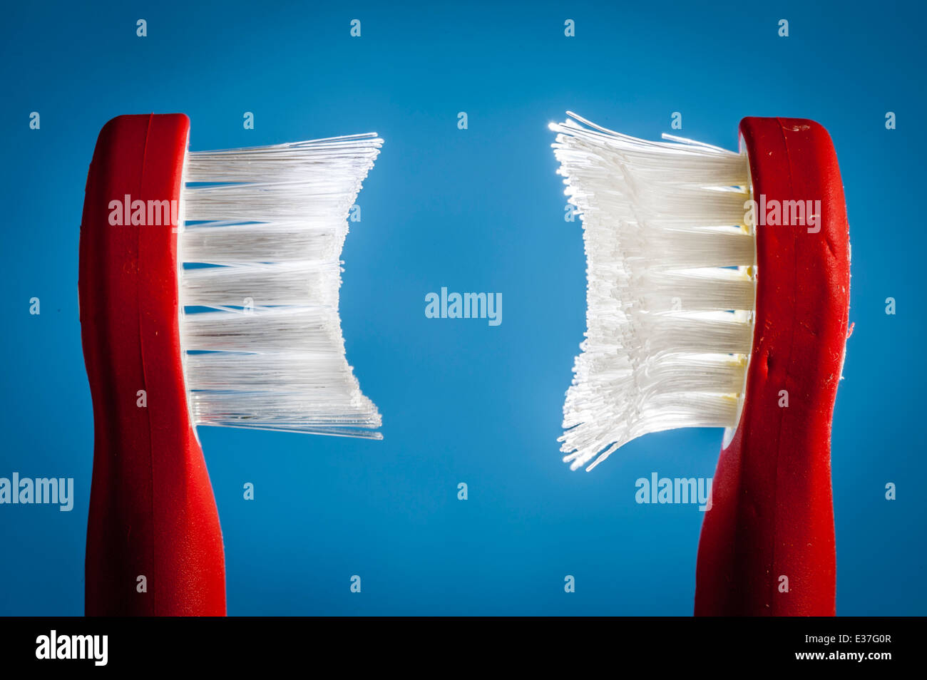 A new and an old, frayed children's toothbrush that needs to be ...