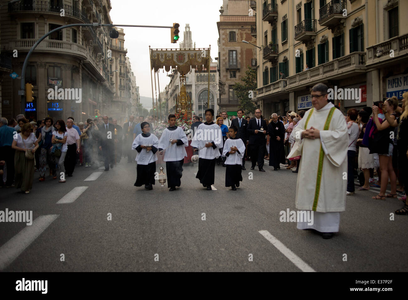 Barcelona, Spain. 22nd June, 2014. Altar boys dawn the street carrying ...