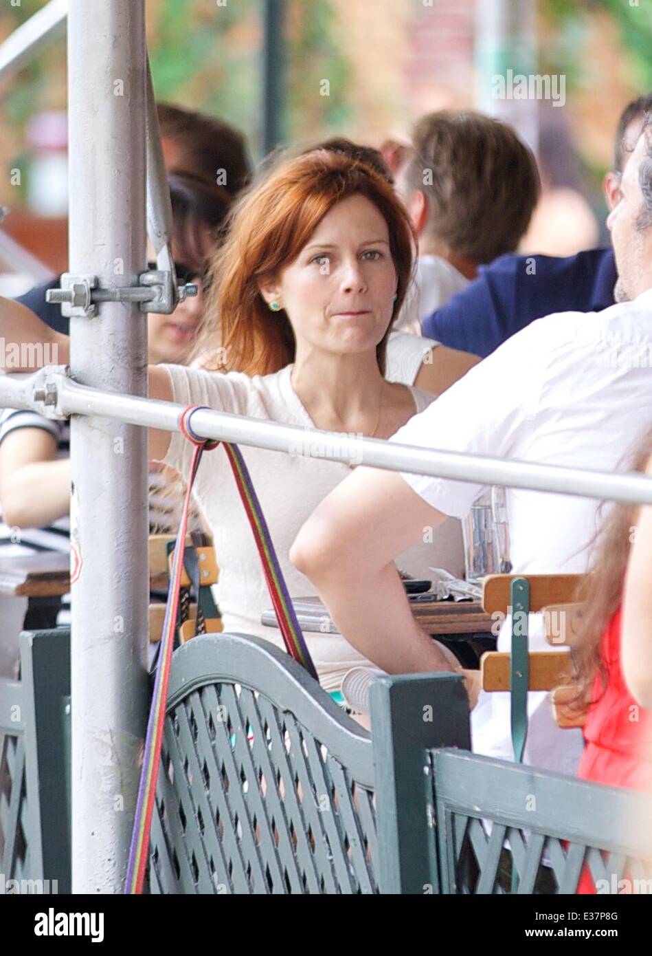 Carla Gugino sitting at an outdoor cafe table with her dog Featuring ...
