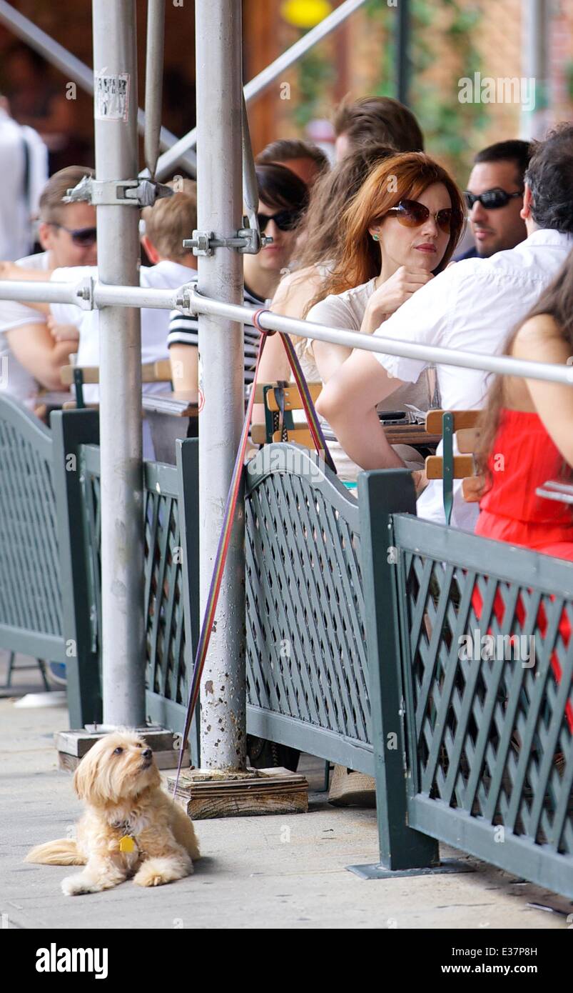 Carla Gugino sitting at an outdoor cafe table with her dog Featuring ...