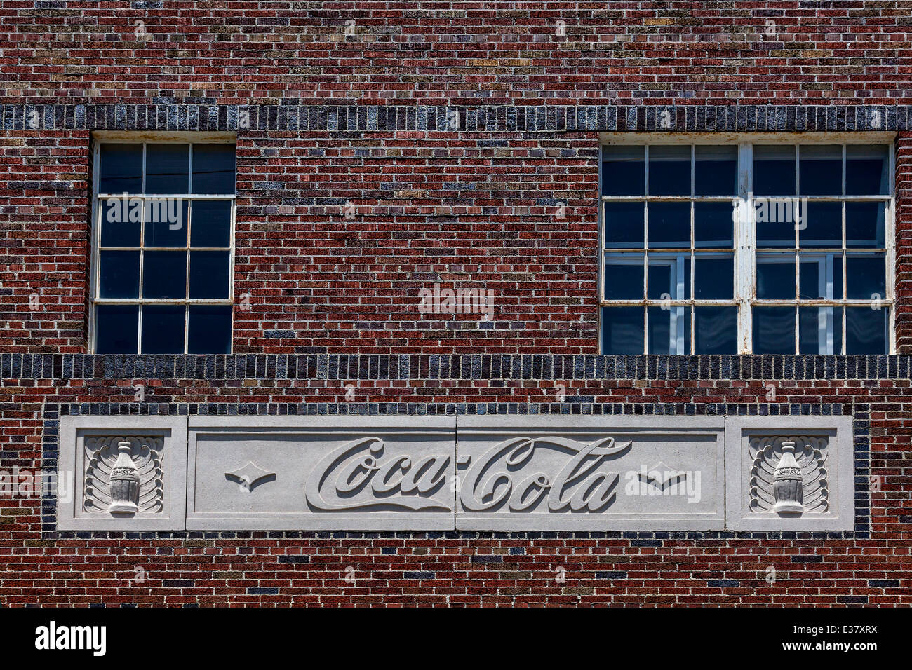 Vintage Coca Cola wall sign in carved bas relief set in the brick wall ...