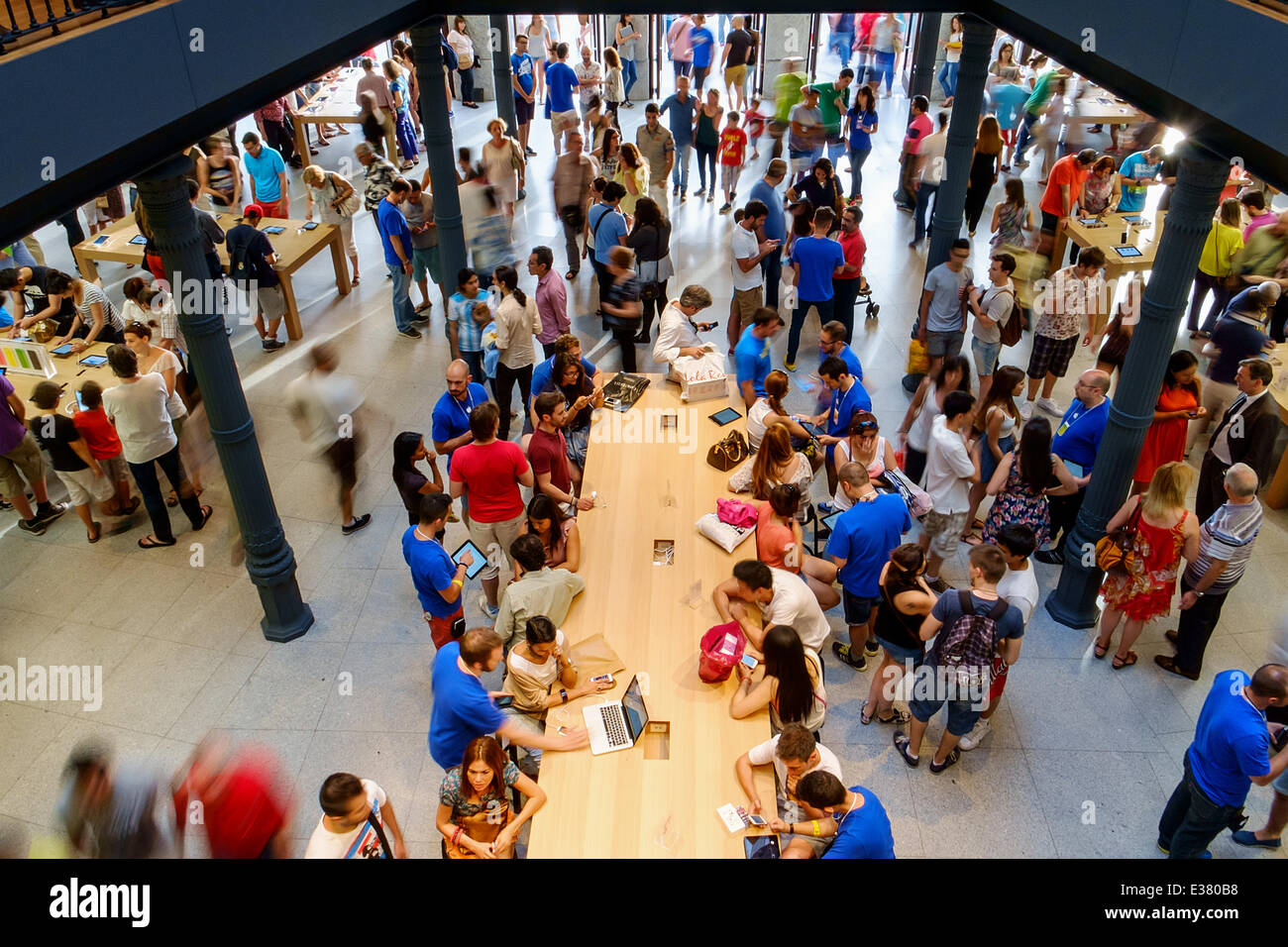 MADRID, SPAIN - JUNE 21 - People inside and outside the Apple store ...