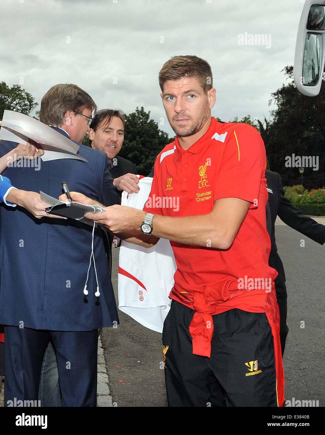 Liverpool F.C. football players, lead by captain Steven Gerrard, arrive ...