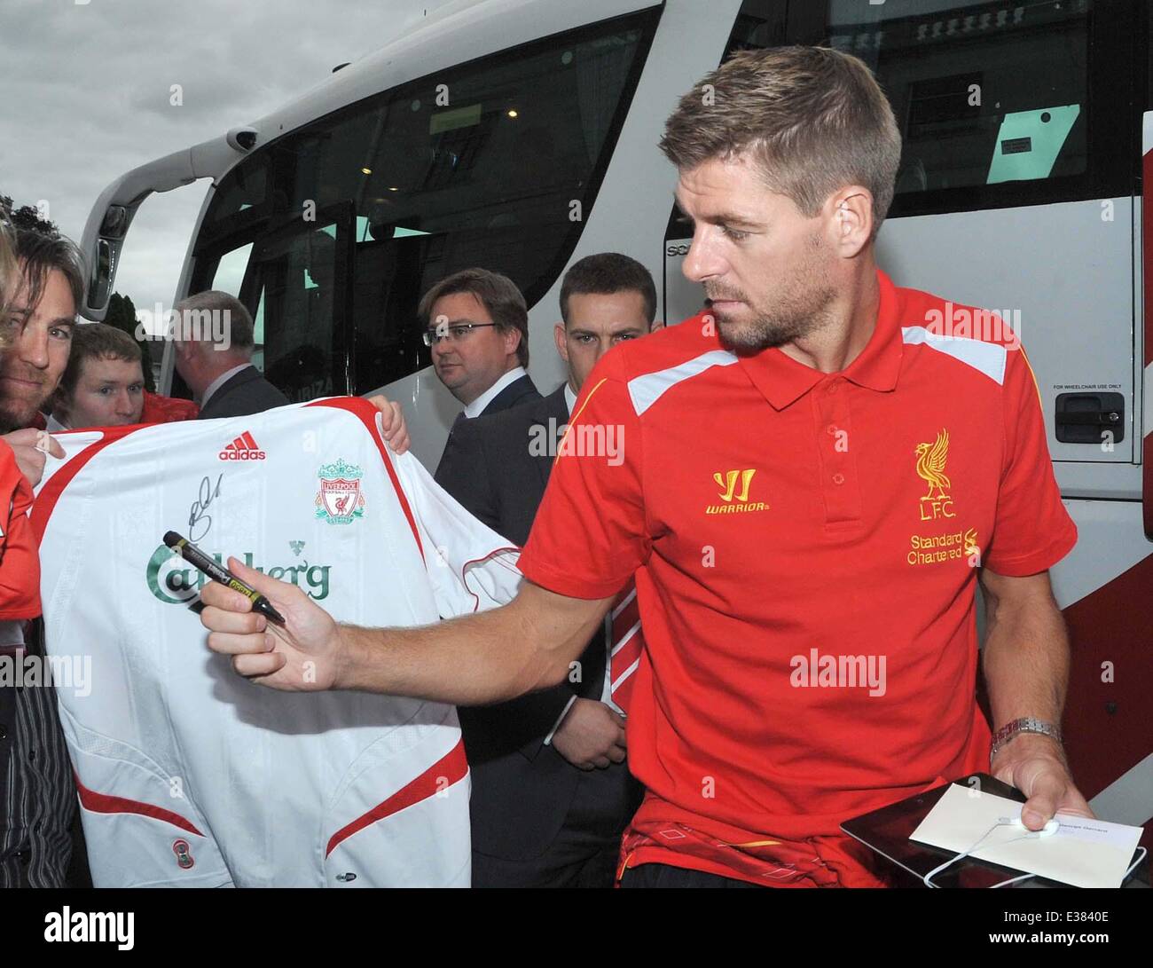 Liverpool F.C. football players, lead by captain Steven Gerrard, arrive ...