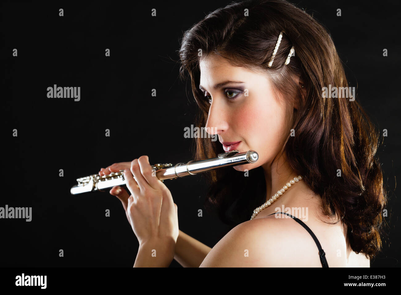 Art and artist. Young elegant woman girl flutist flautist performer ...