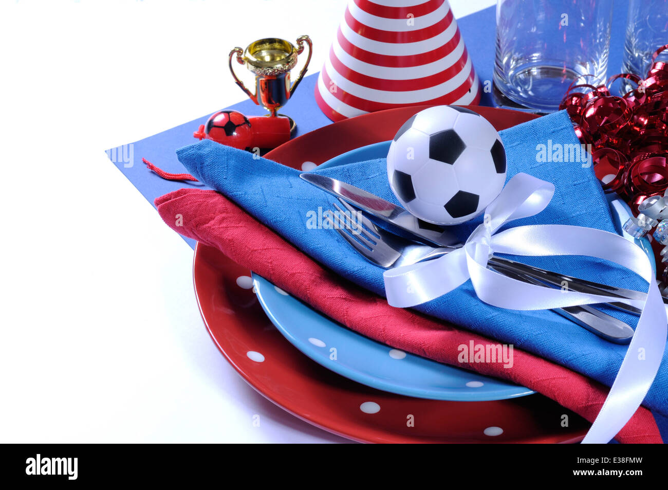 Soccer football party table setting with pates, cutlery, glasses ...