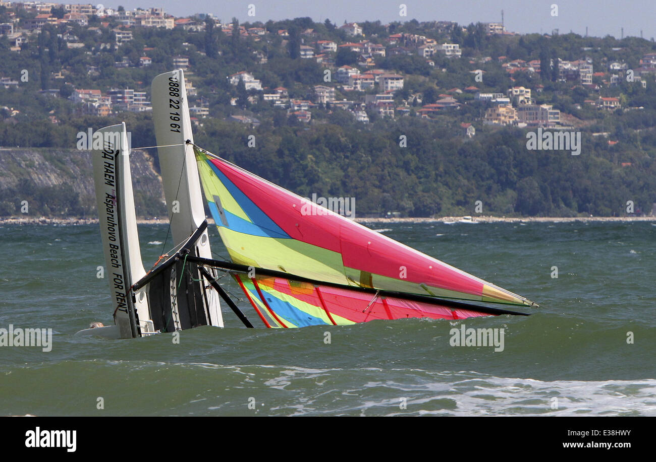 People watch at sinking catamaran yacht during a heavy wind storm at ...