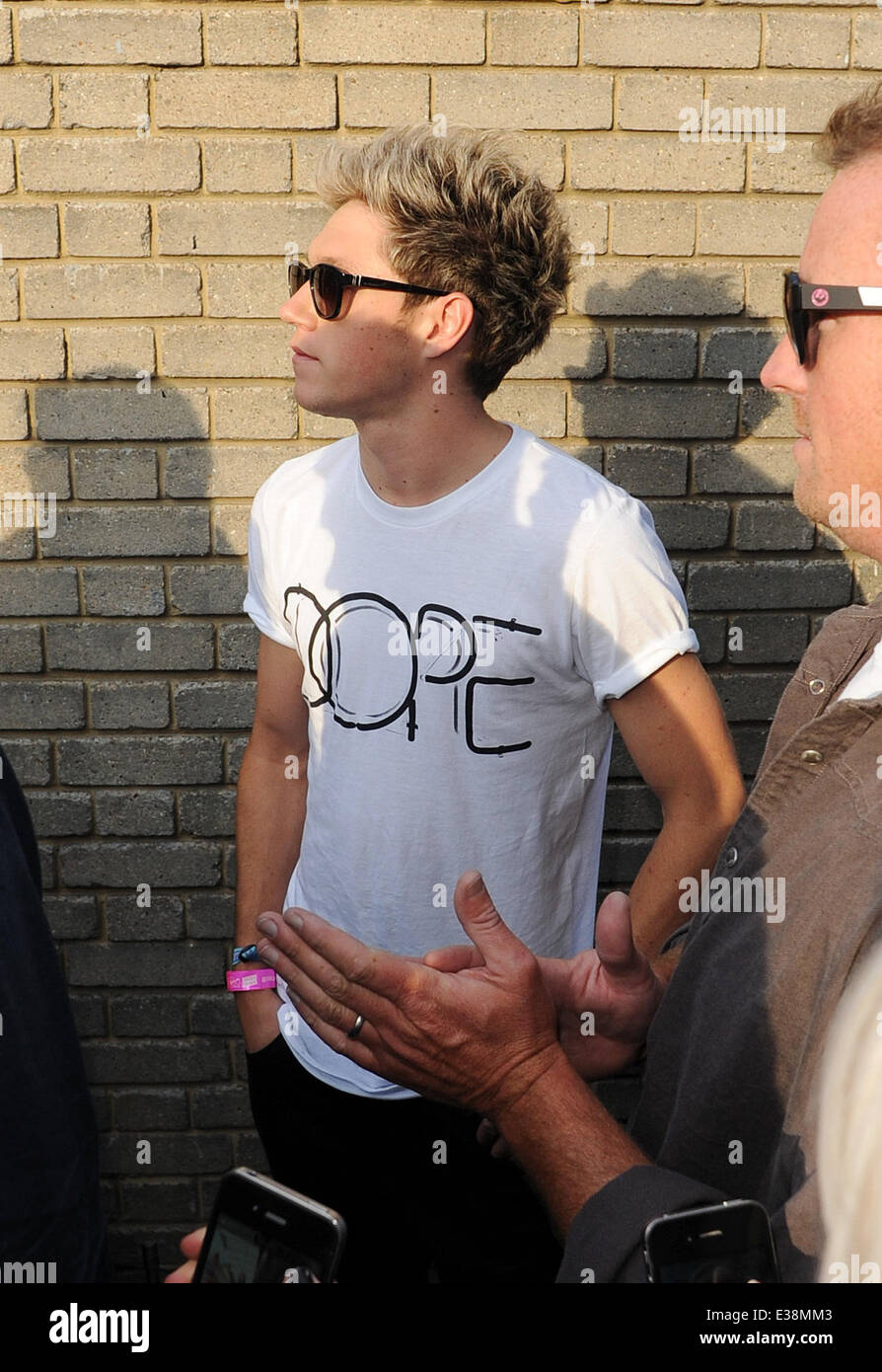 One Direction greet their fans outside their studios after a ...