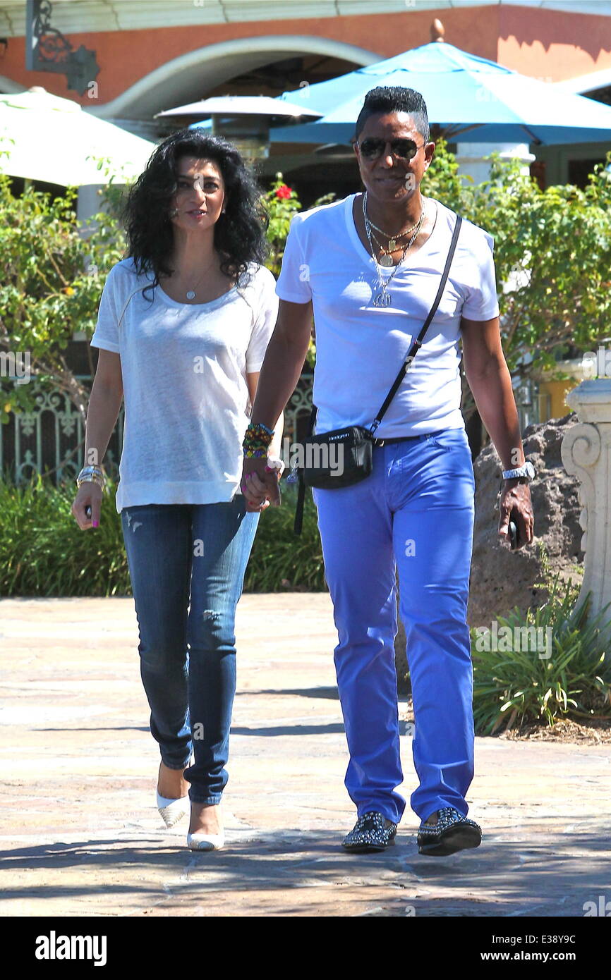 Jermaine Jackson walking holding hands with his wife Halima Rashid ...