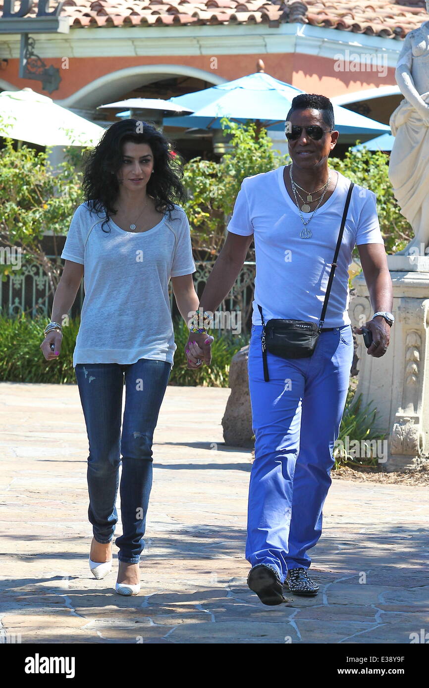 Jermaine Jackson walking holding hands with his wife Halima Rashid ...