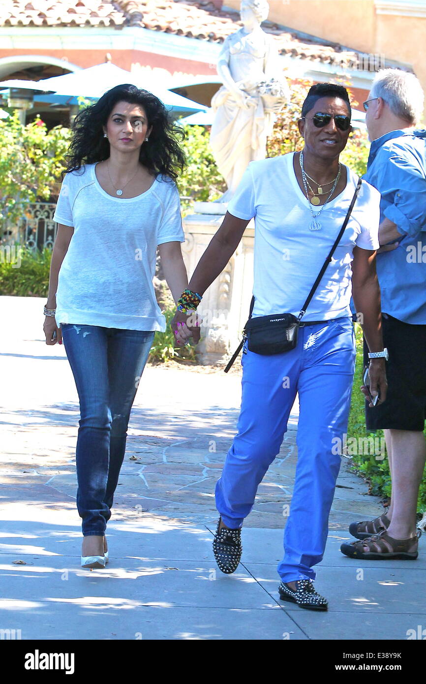 Jermaine Jackson walking holding hands with his wife Halima Rashid ...