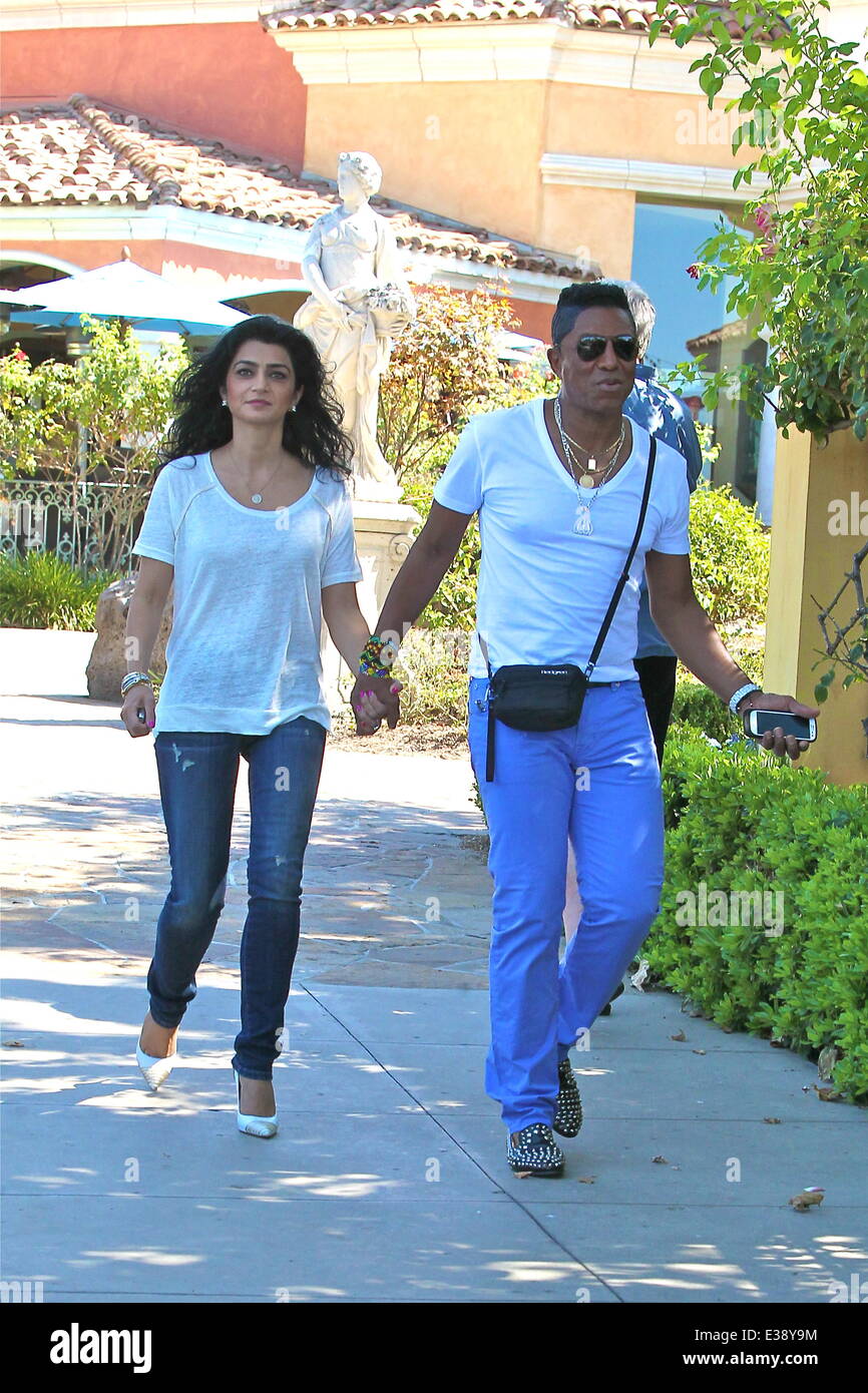 Jermaine Jackson walking holding hands with his wife Halima Rashid ...