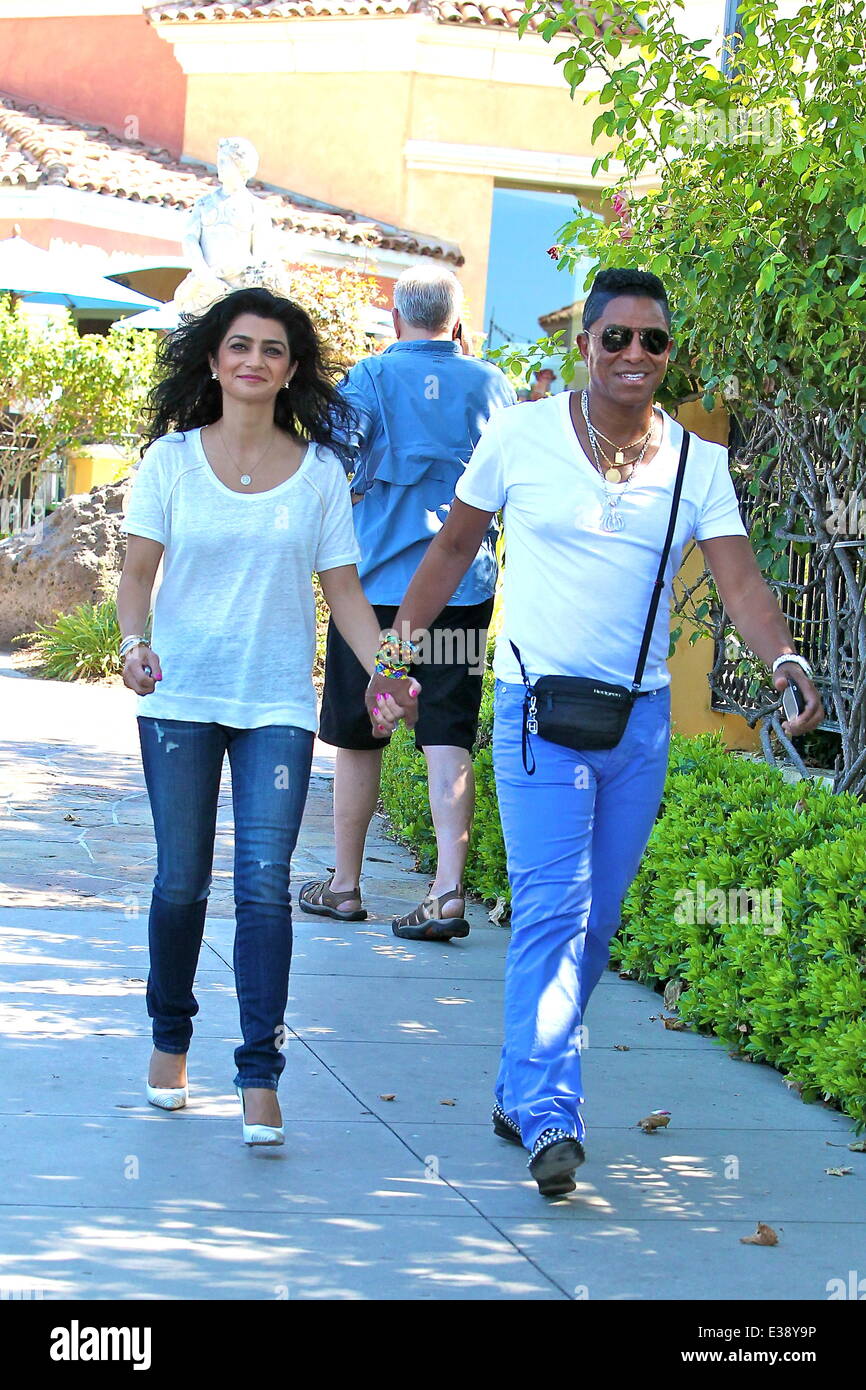 Jermaine Jackson walking holding hands with his wife Halima Rashid ...