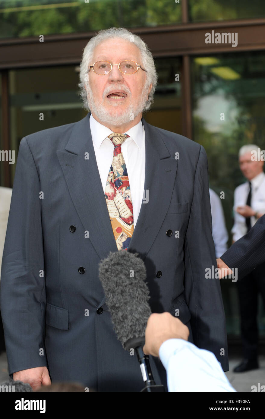 Dave Lee Travis is pictured leaving Westminster Magistrates Court today ...