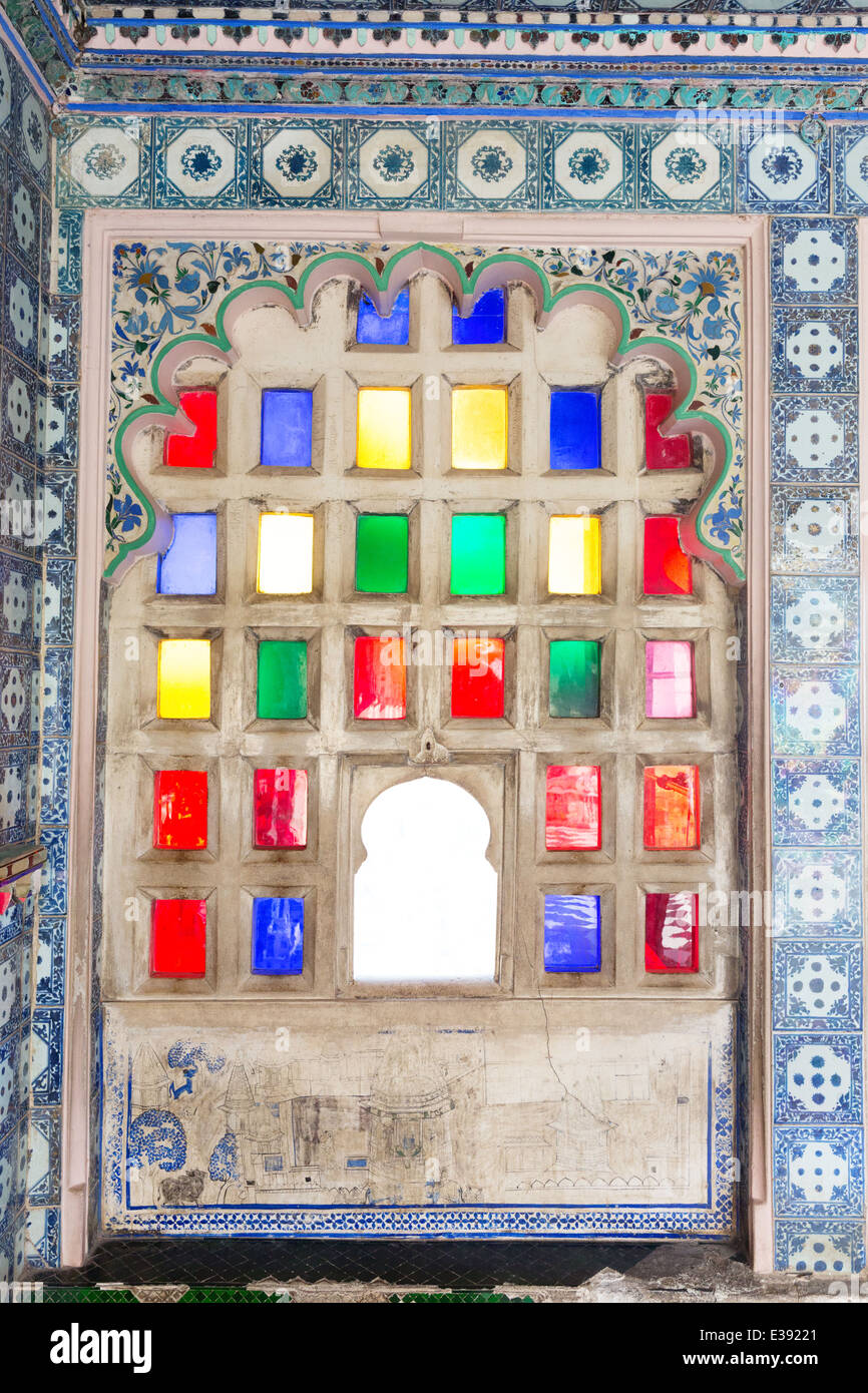 Window with multi-colored panels decorated with blue European tile ...