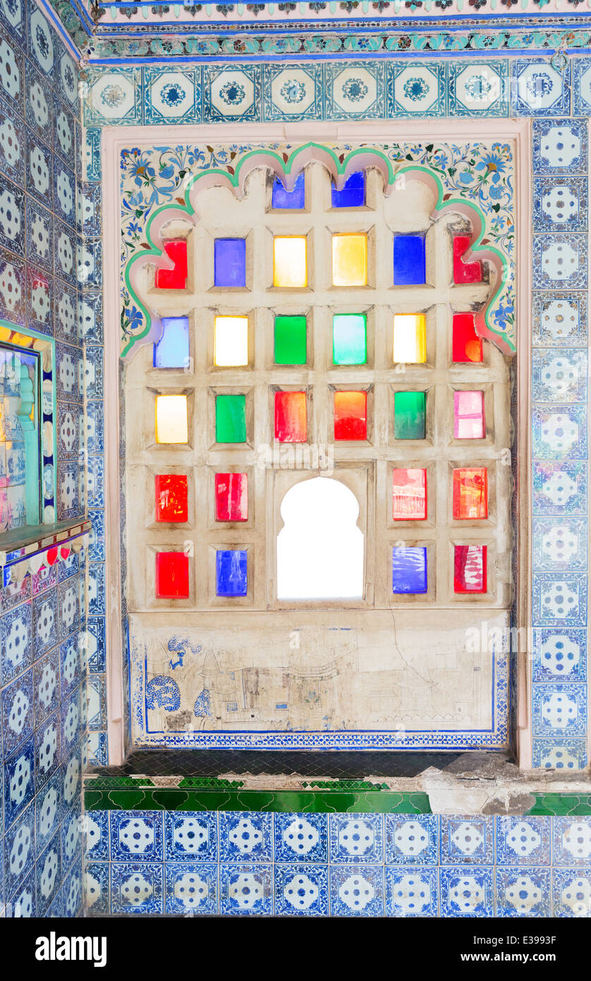Window with multi-colored panels decorated with blue European tile ...