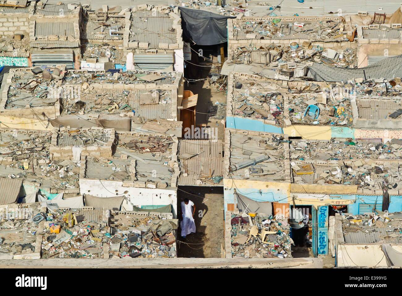 Nouakchott, Mauritania. 20th June, 2014. A local citizen walks through ...
