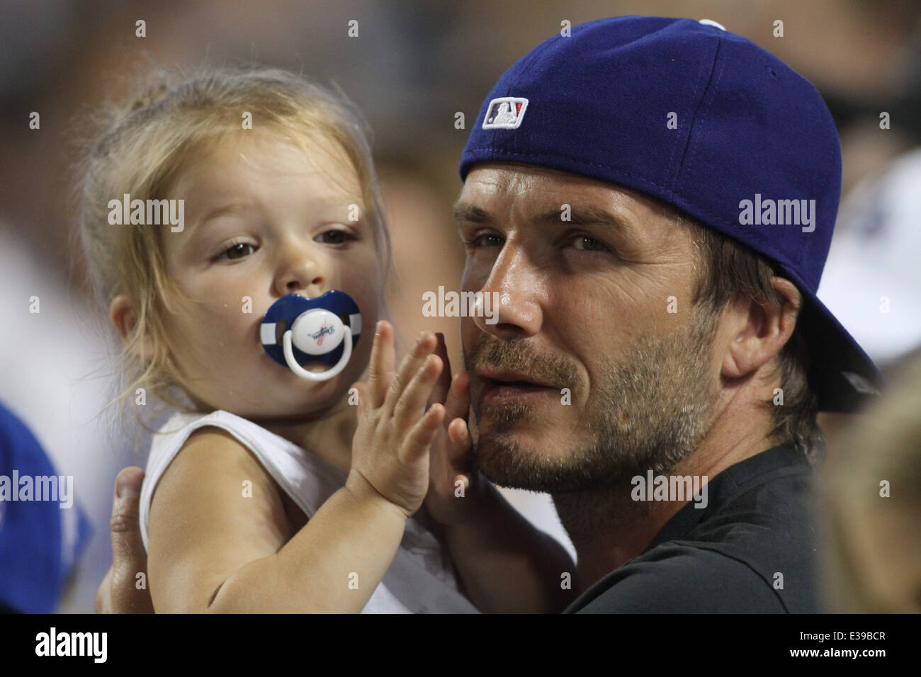 Doting father David Beckham takes his baby daughter Harper to the Los ...