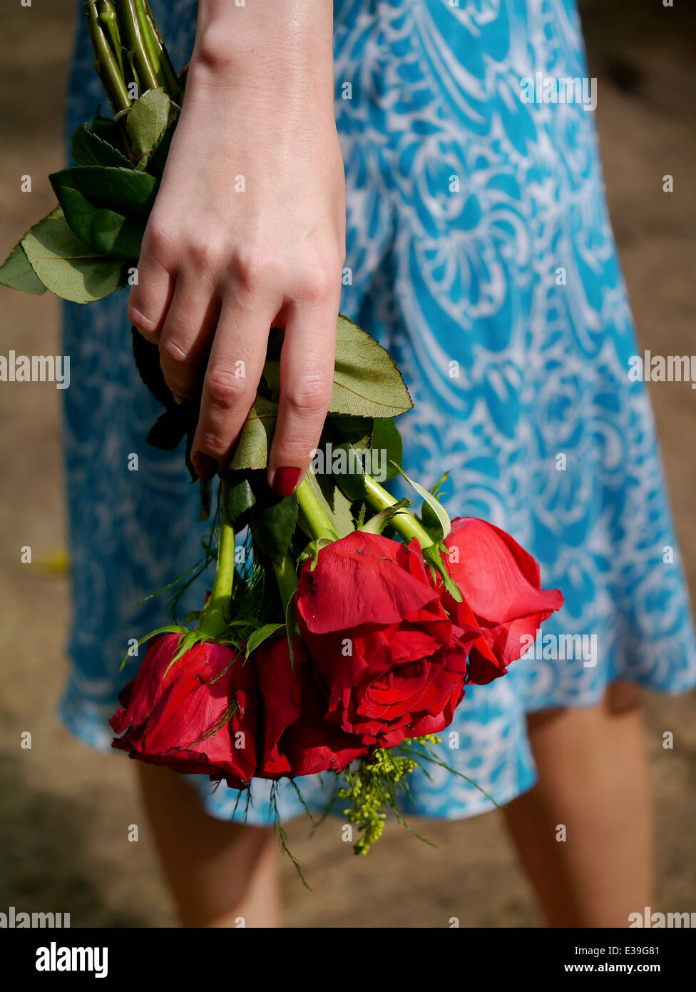 Hand and flowers and blue hi-res stock photography and images - Alamy