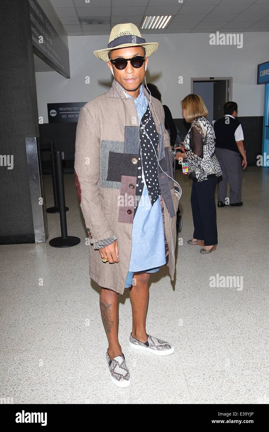 Pharrell Williams arrives at LAX in style. He wore a patchwork coat ...