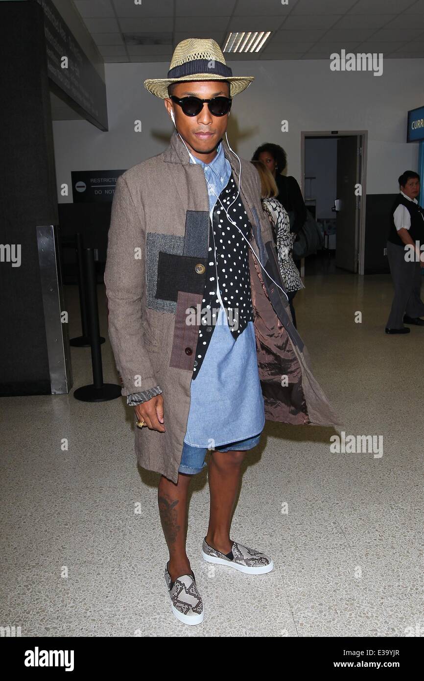 Pharrell Williams arrives at LAX in style. He wore a patchwork coat ...