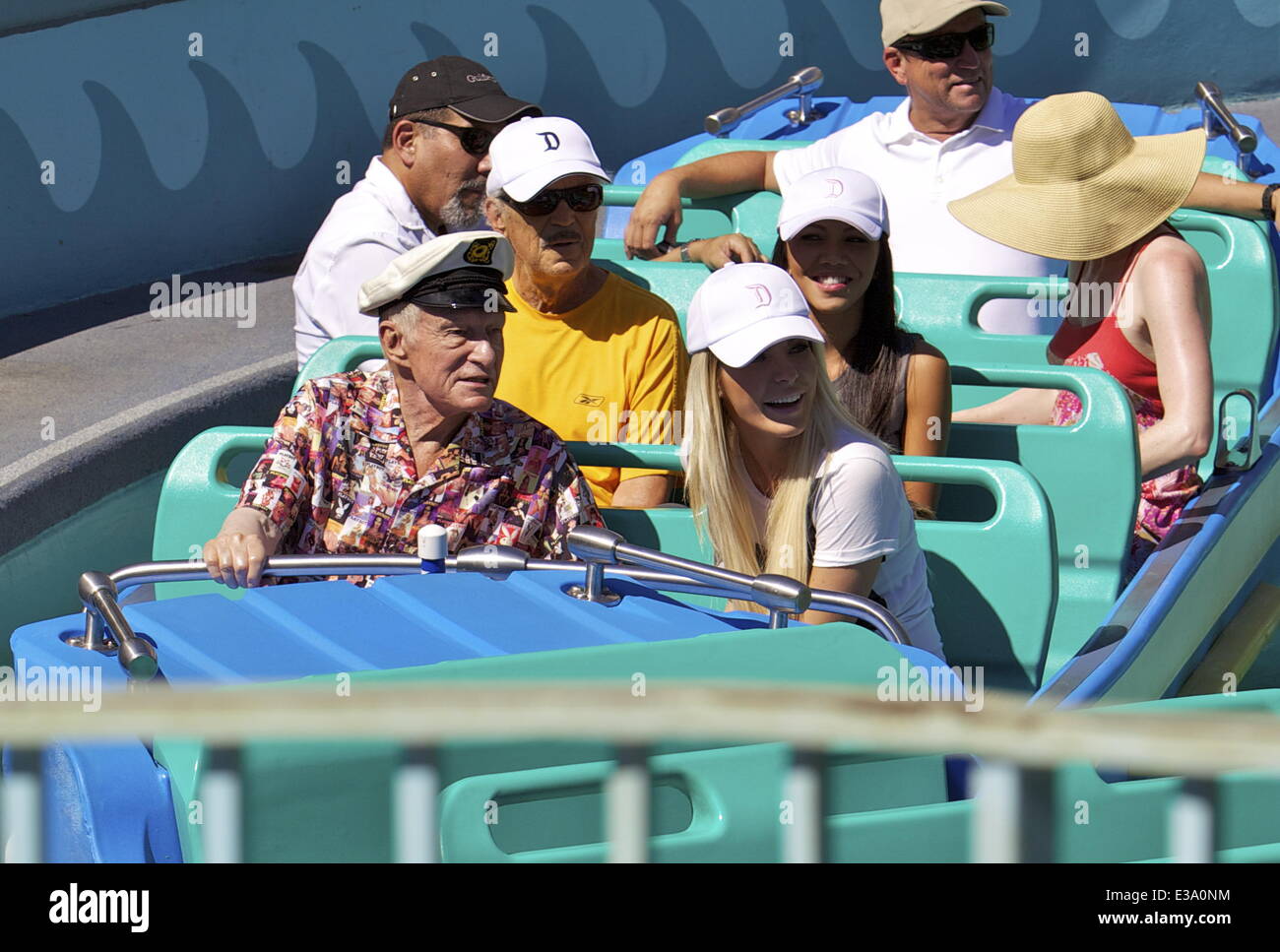 Hugh Hefner and Crystal Hefner ride mobility scooters through ...