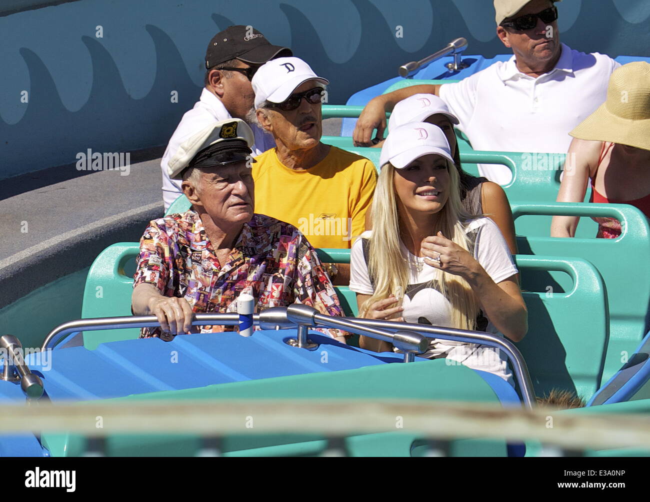 Hugh Hefner and Crystal Hefner ride mobility scooters through ...